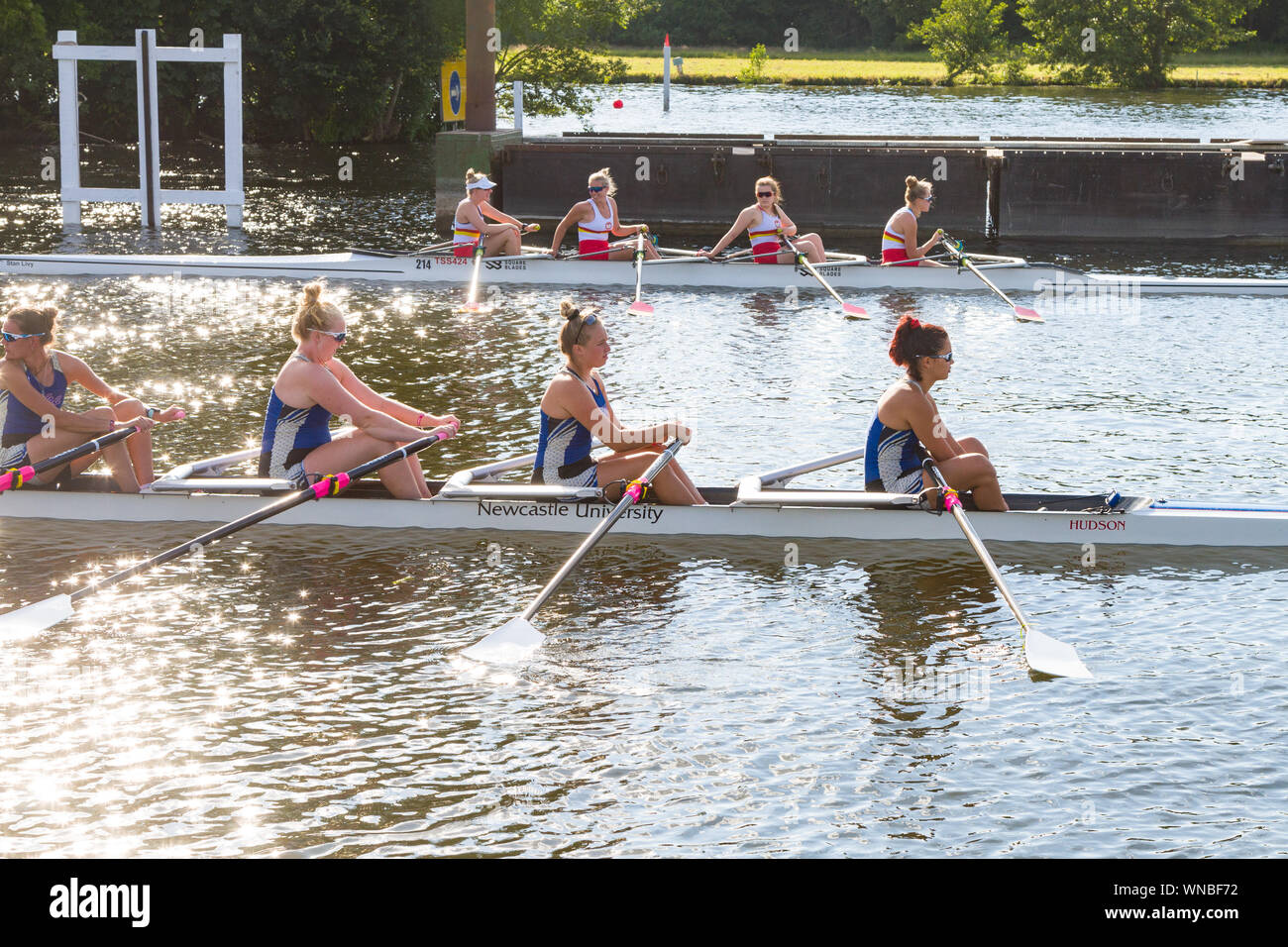 Two crews at the start of a race at Henley Womens Regatta Stock Photo ...