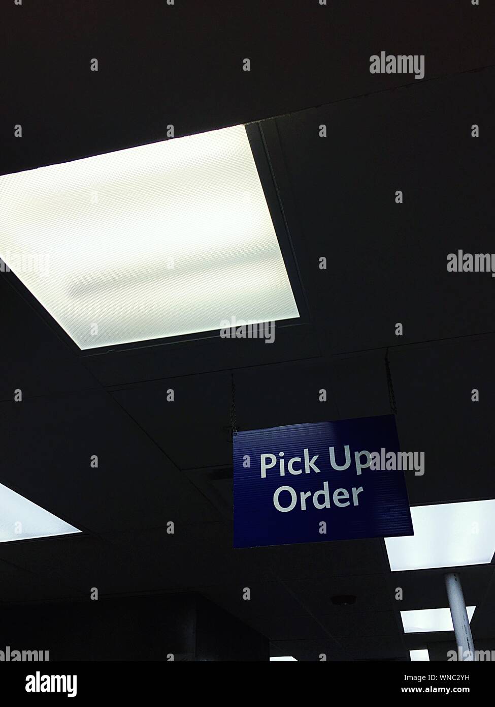 Sign hanging from ceiling hi-res stock photography and images - Alamy