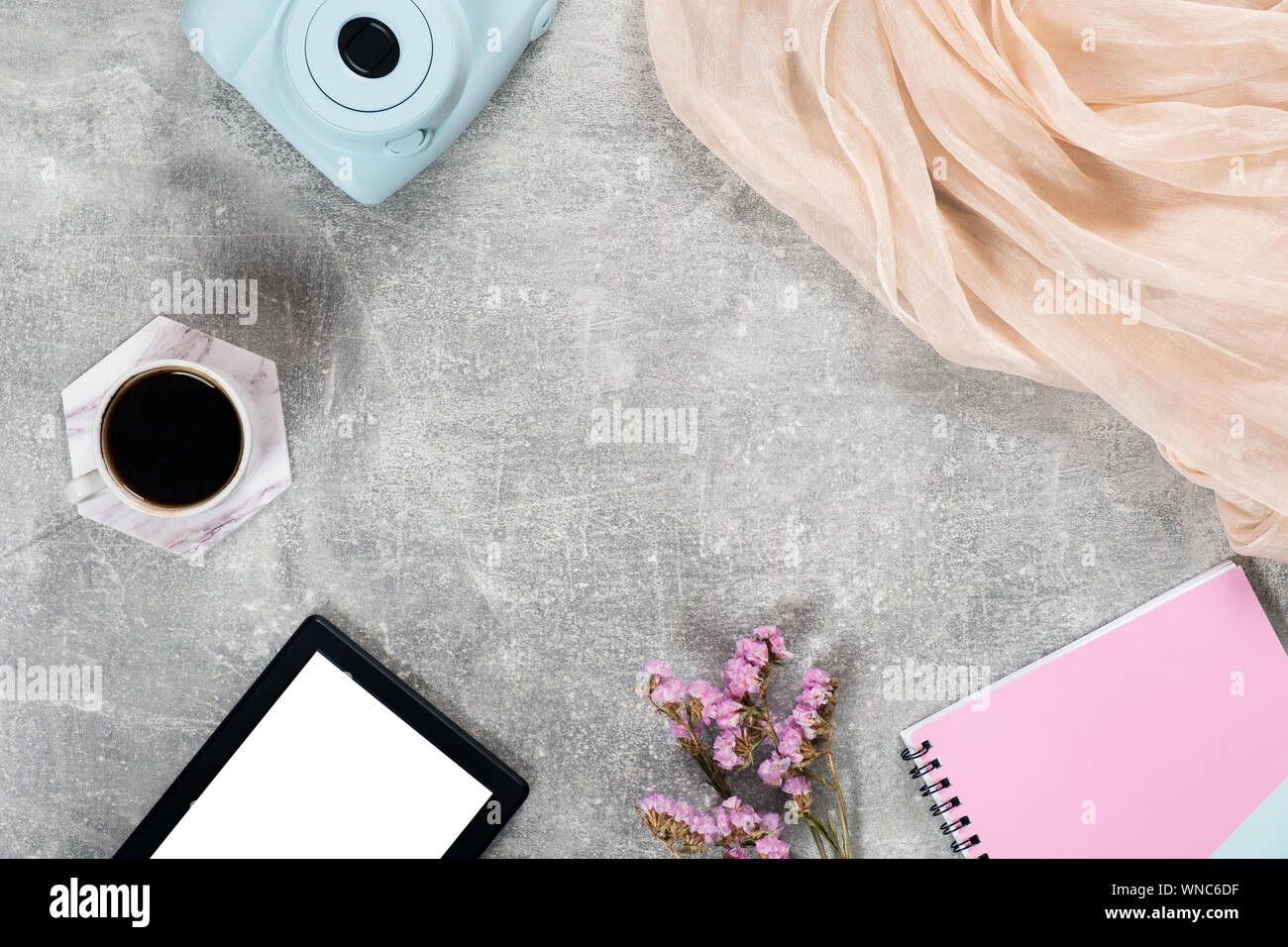 Top view stylish frame set of beauty blogger items of concrete surface ...