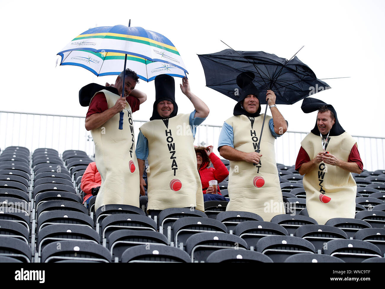 Spectators in the stands dressed as cricket bats during day three of ...