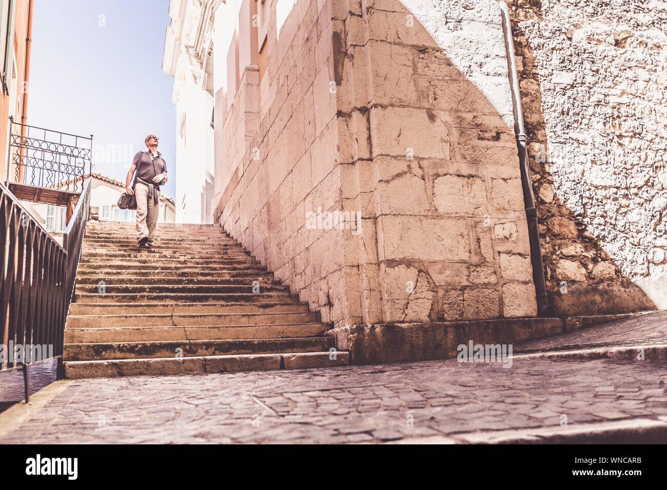 Old man walking up steps hi-res stock photography and images - Alamy