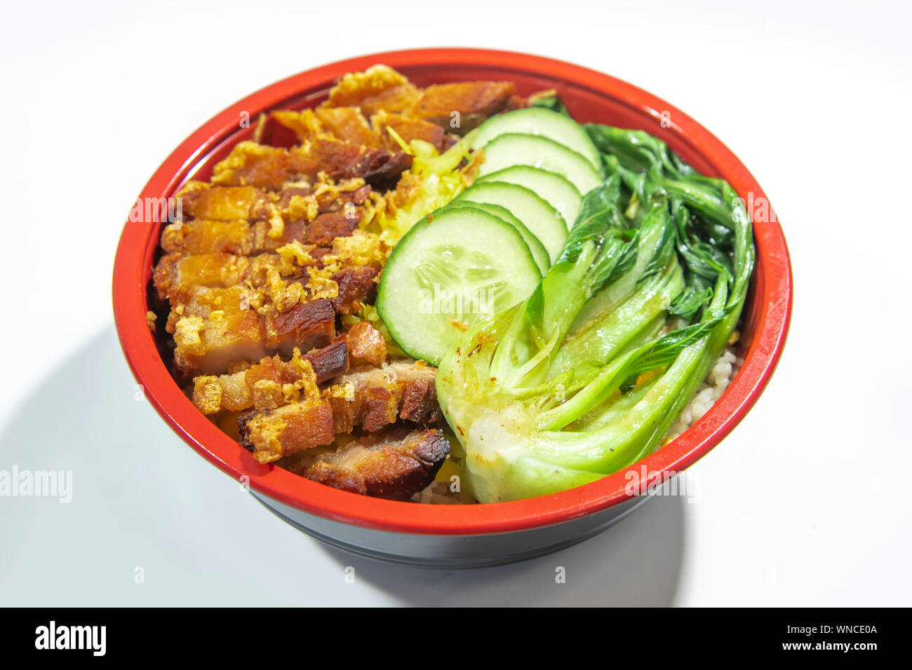 Crispy fried pork belly service with Chinese cabbage and fried rice ...