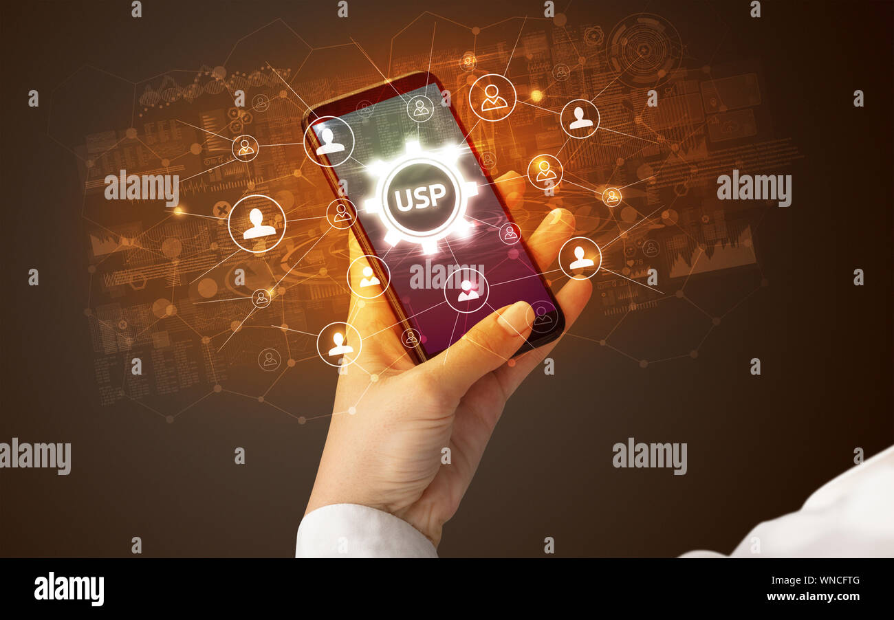 Female hand holding smartphone with USP abbreviation, modern technology ...