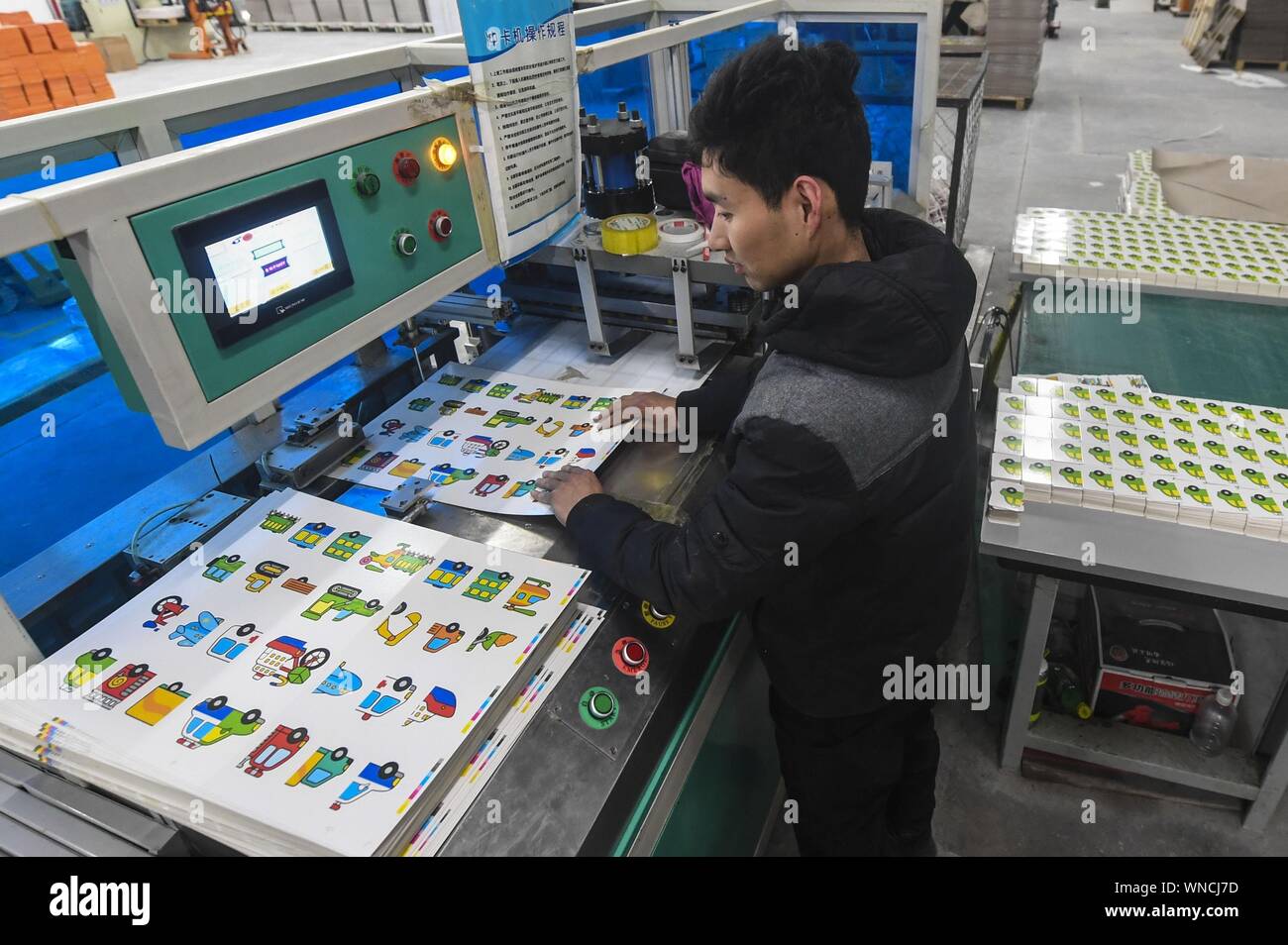 Beijing, China's Hebei Province. 8th Apr, 2018. Workers operate a press ...