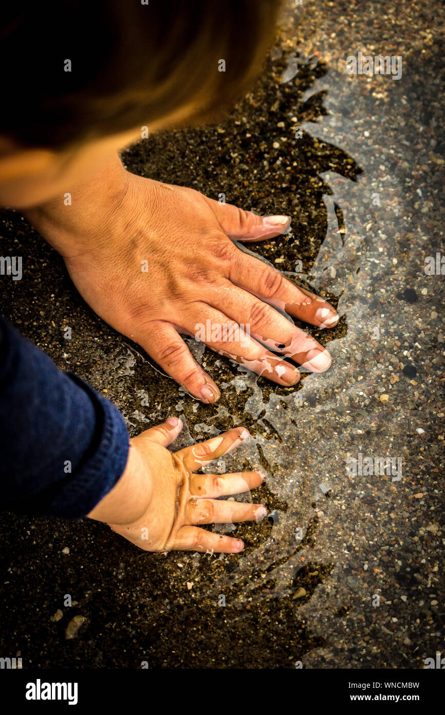 Child puddle parent hi-res stock photography and images - Alamy