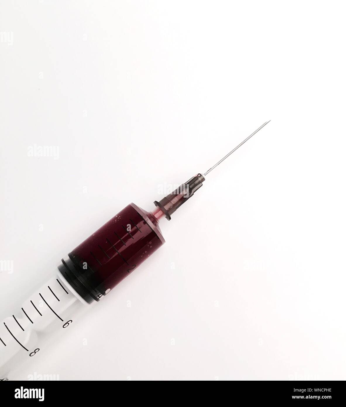 Syringe filled with blood hi-res stock photography and images - Alamy