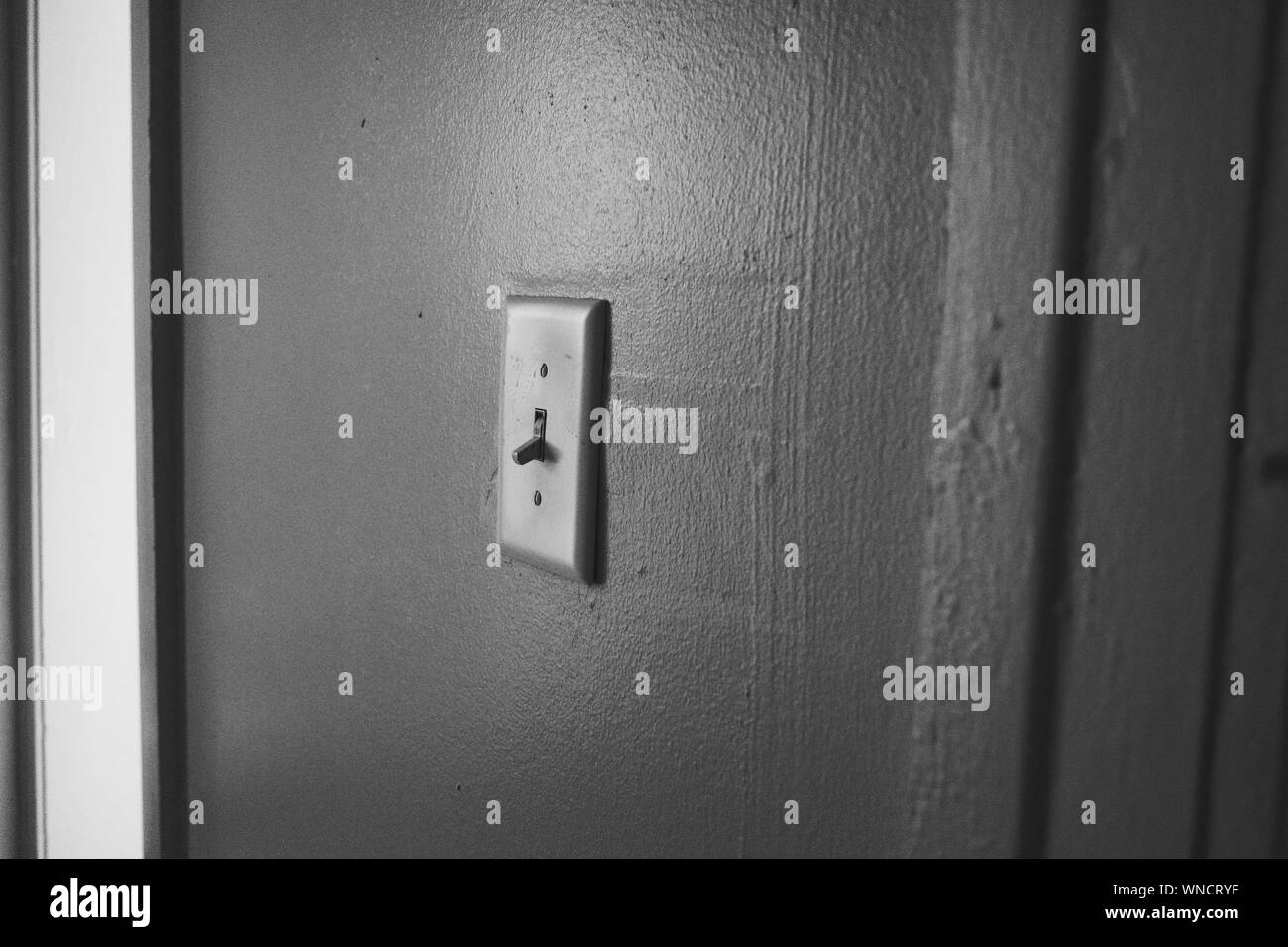 Light switch on the wall Black and White Stock Photos & Images - Alamy