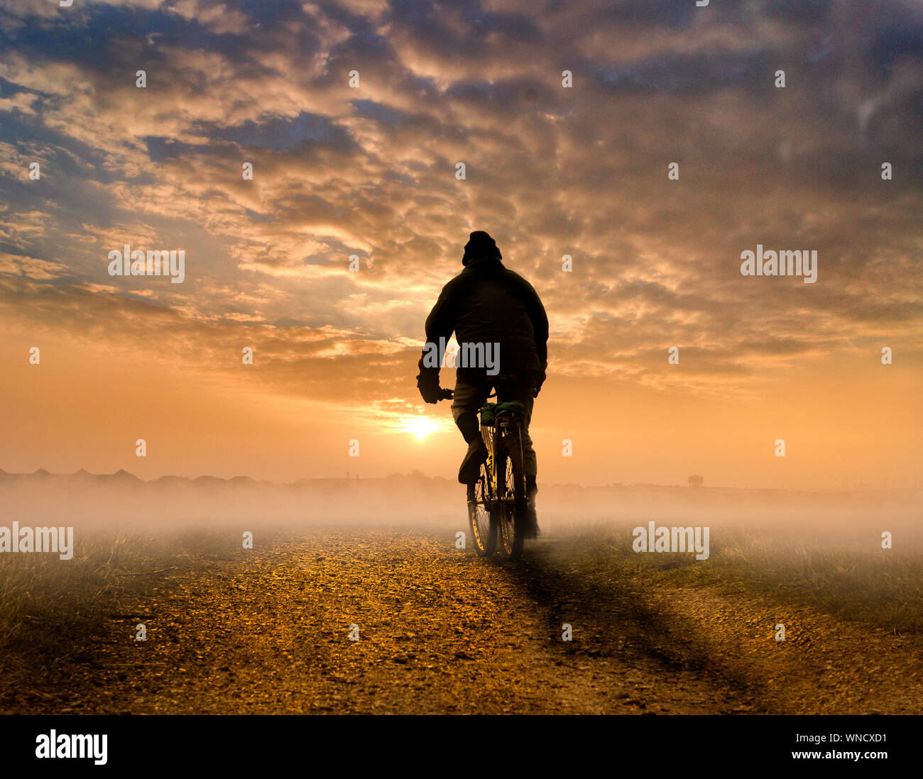 Red sky morning cyclist hi-res stock photography and images - Alamy
