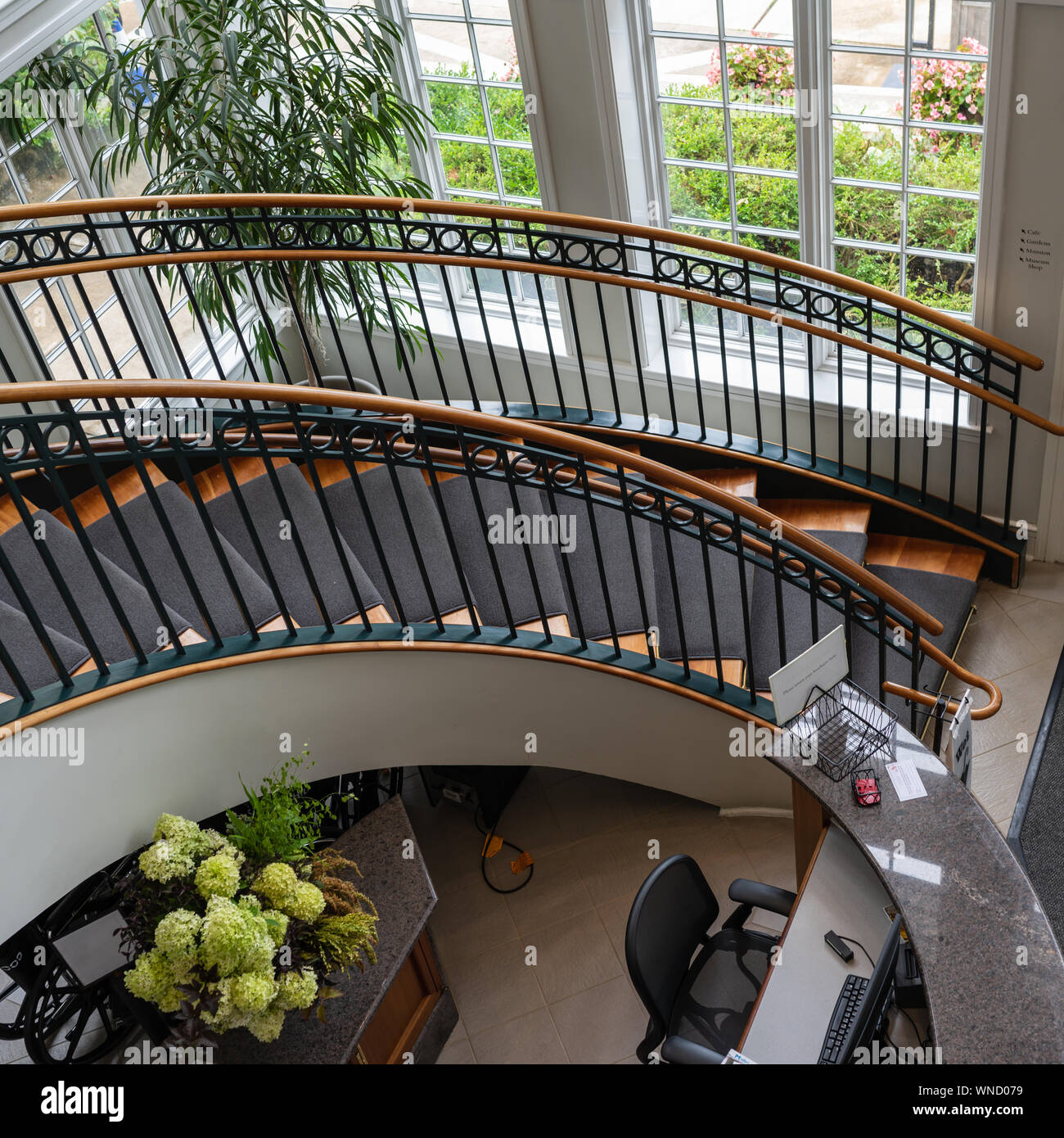 Photo of an office reception area bounded by a spiral staircase Stock ...