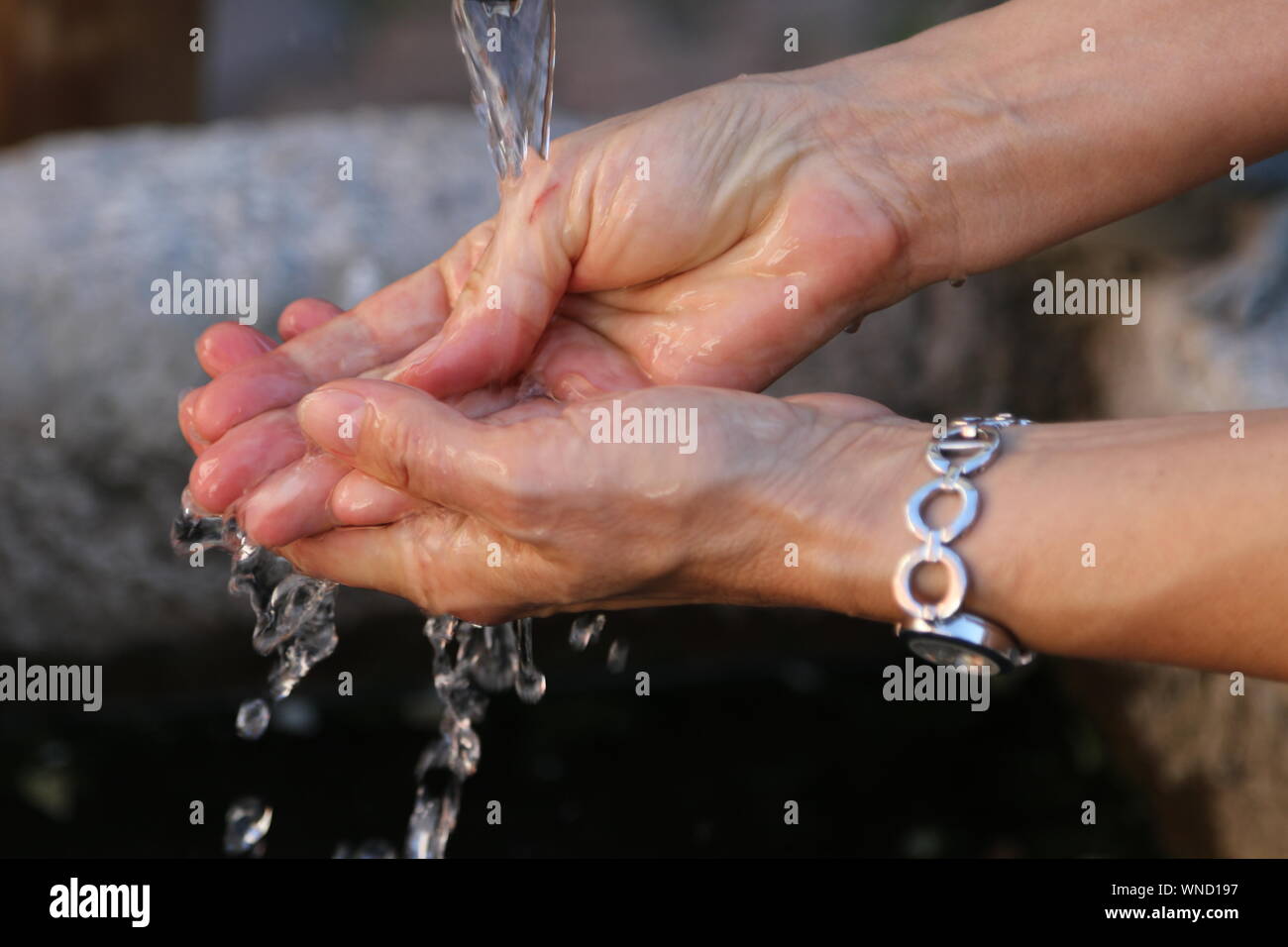 Person washing hands hi-res stock photography and images - Alamy