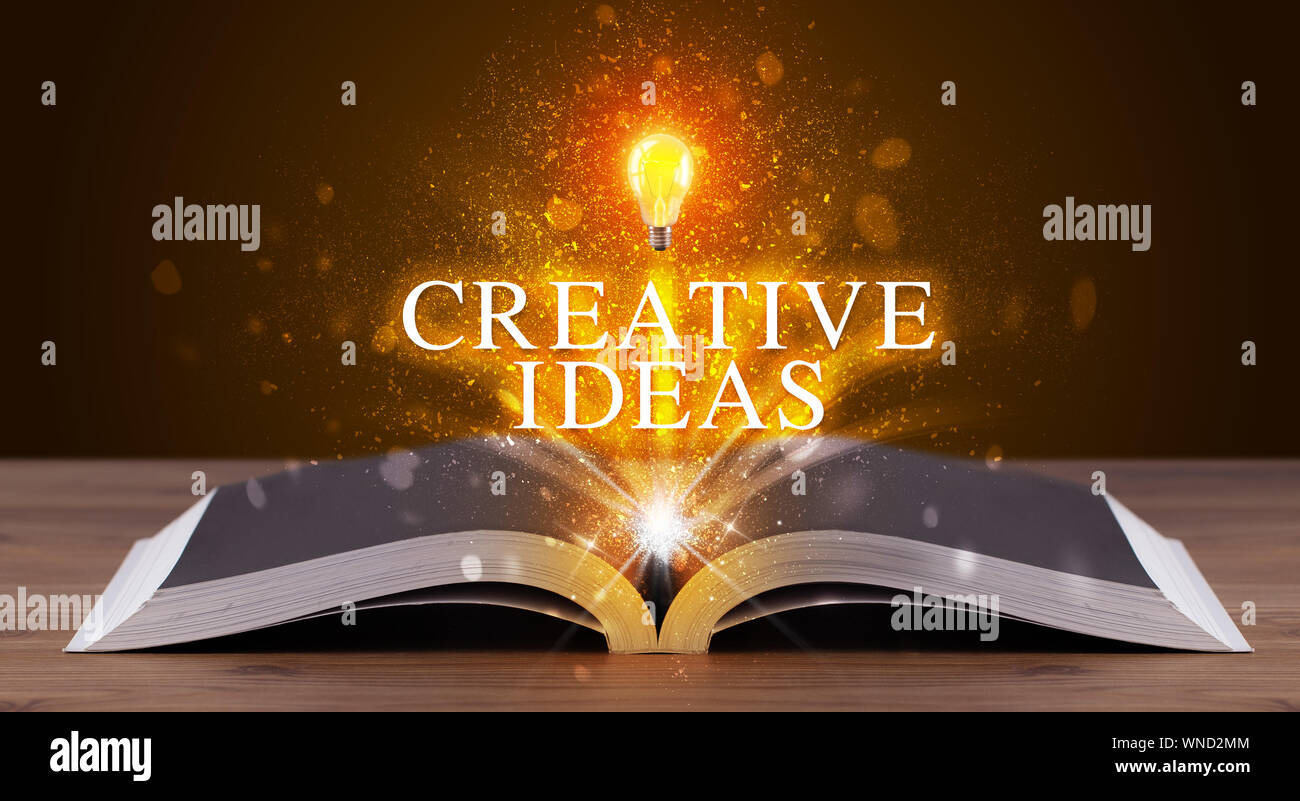 CREATIVE IDEAS inscription coming out from an open book, educational ...