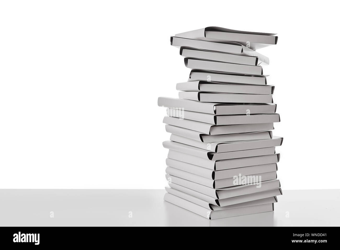 Stack of white office folders on a white background Stock Photo - Alamy