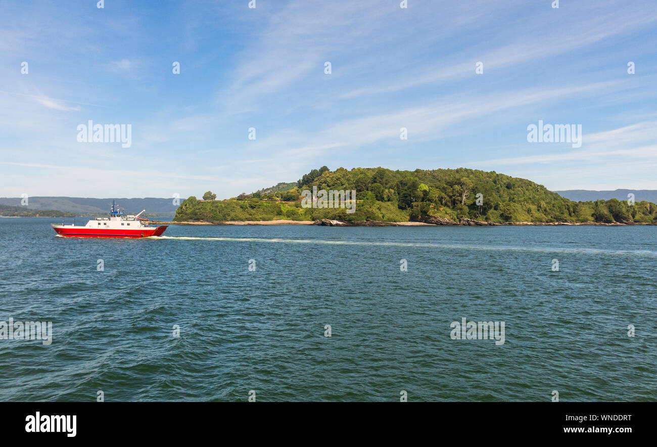 A ferry boat sails along the Valdivia River, in the Rio Region, in ...