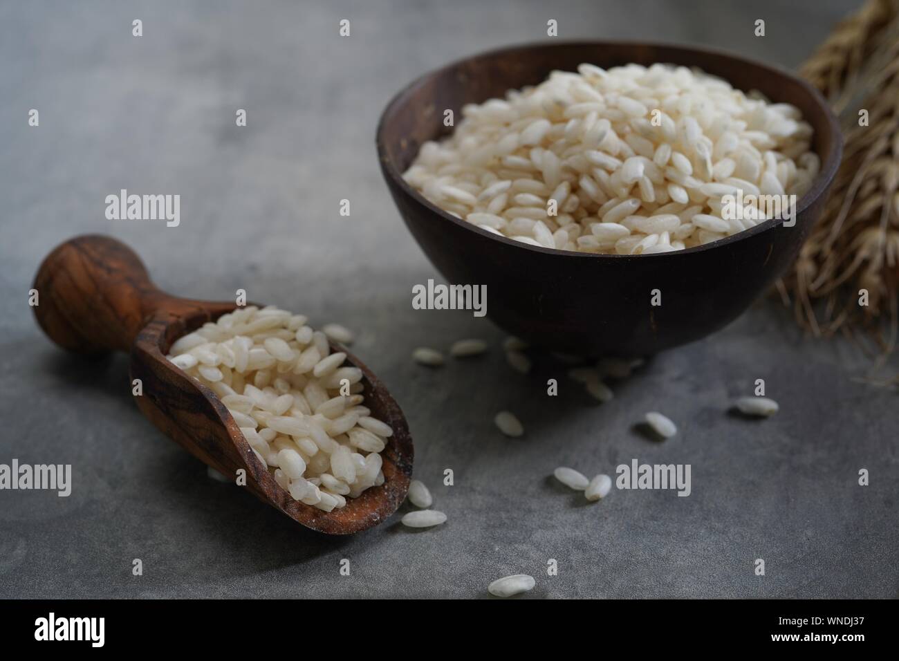 Raw Arborio rice in a bowl still life background Stock Photo - Alamy