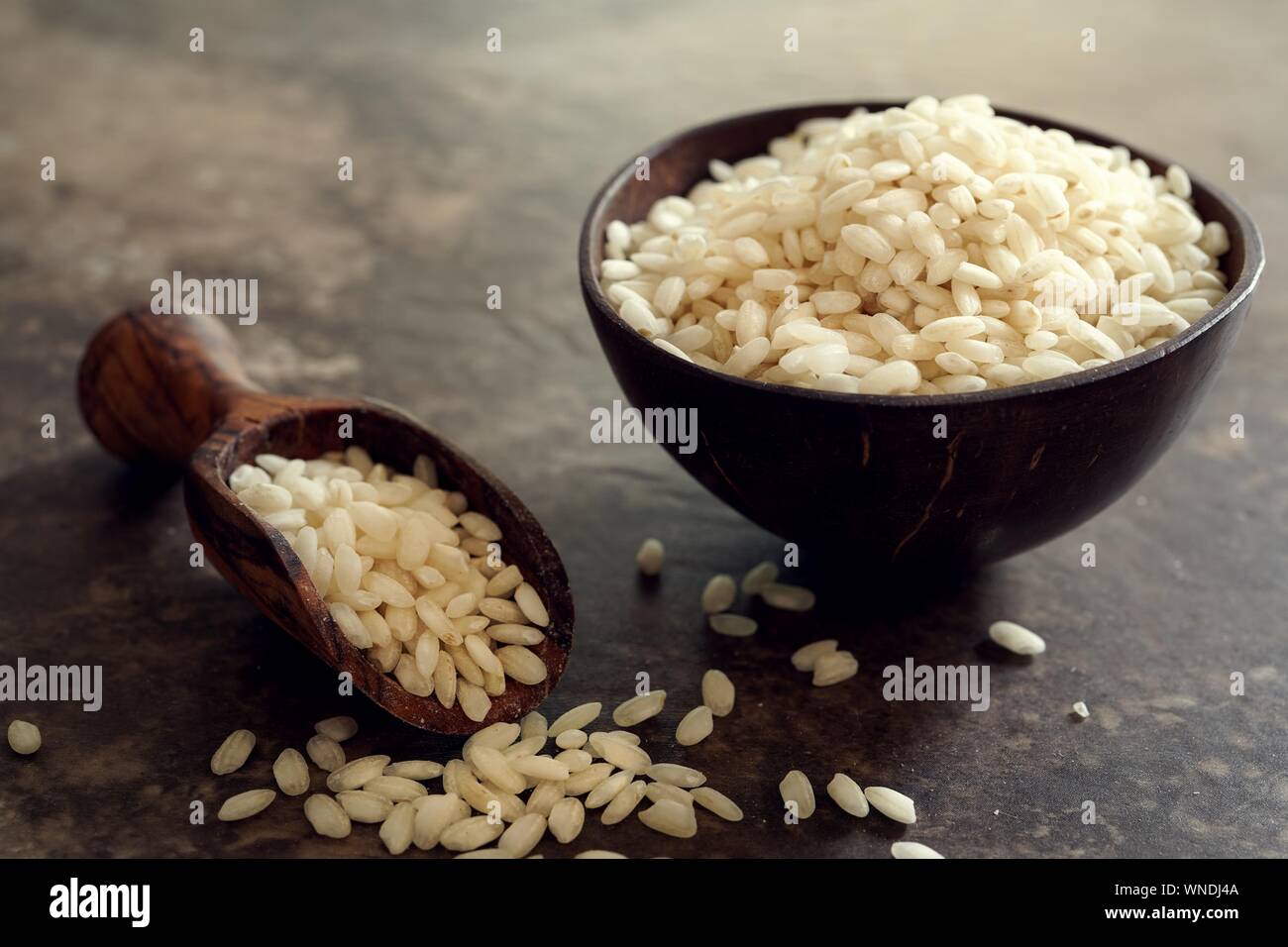 Raw Arborio rice in a bowl still life background Stock Photo - Alamy