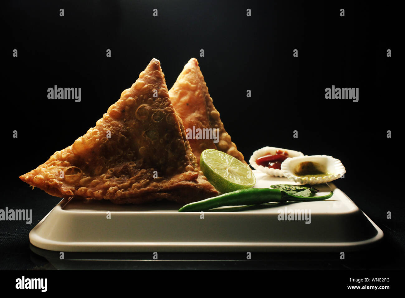 Samosa green background hi-res stock photography and images - Alamy