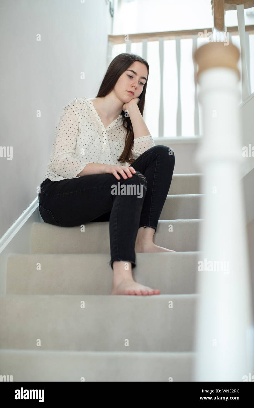 Teen girl sitting on stairs hi-res stock photography and images - Alamy