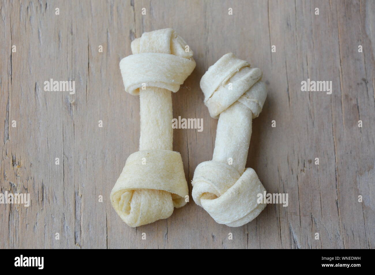 dog bone made from dried cow leather for feeding pet Stock Photo - Alamy