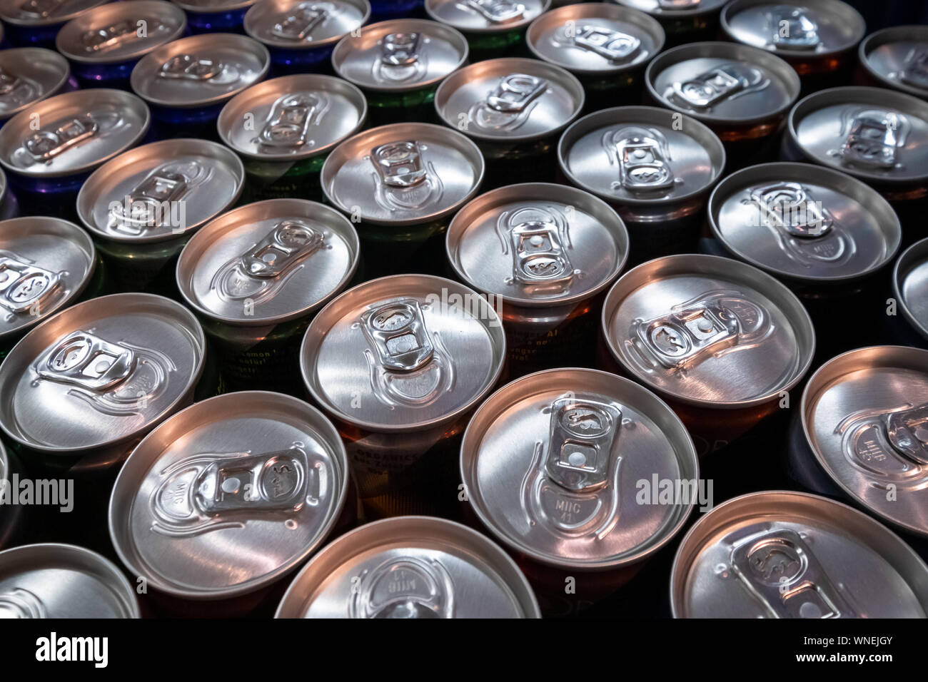 Packaging drinks in aluminum cans in a store, close-up, top view Stock ...