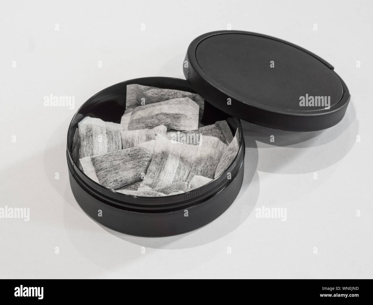 Swedish snus on white background with black box Stock Photo - Alamy