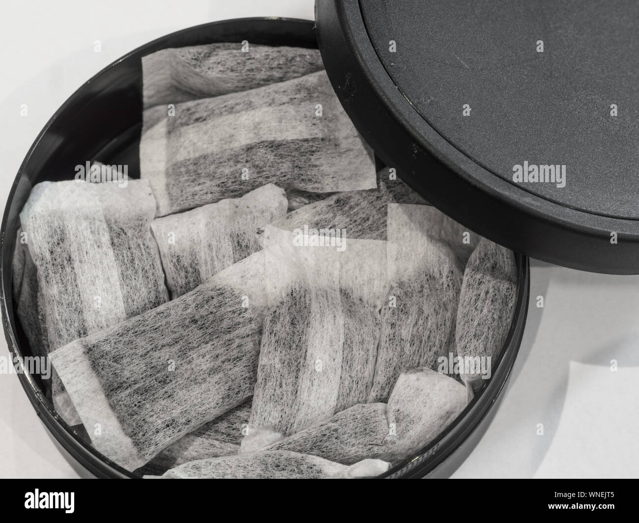 Swedish snus on white background with black box Stock Photo - Alamy