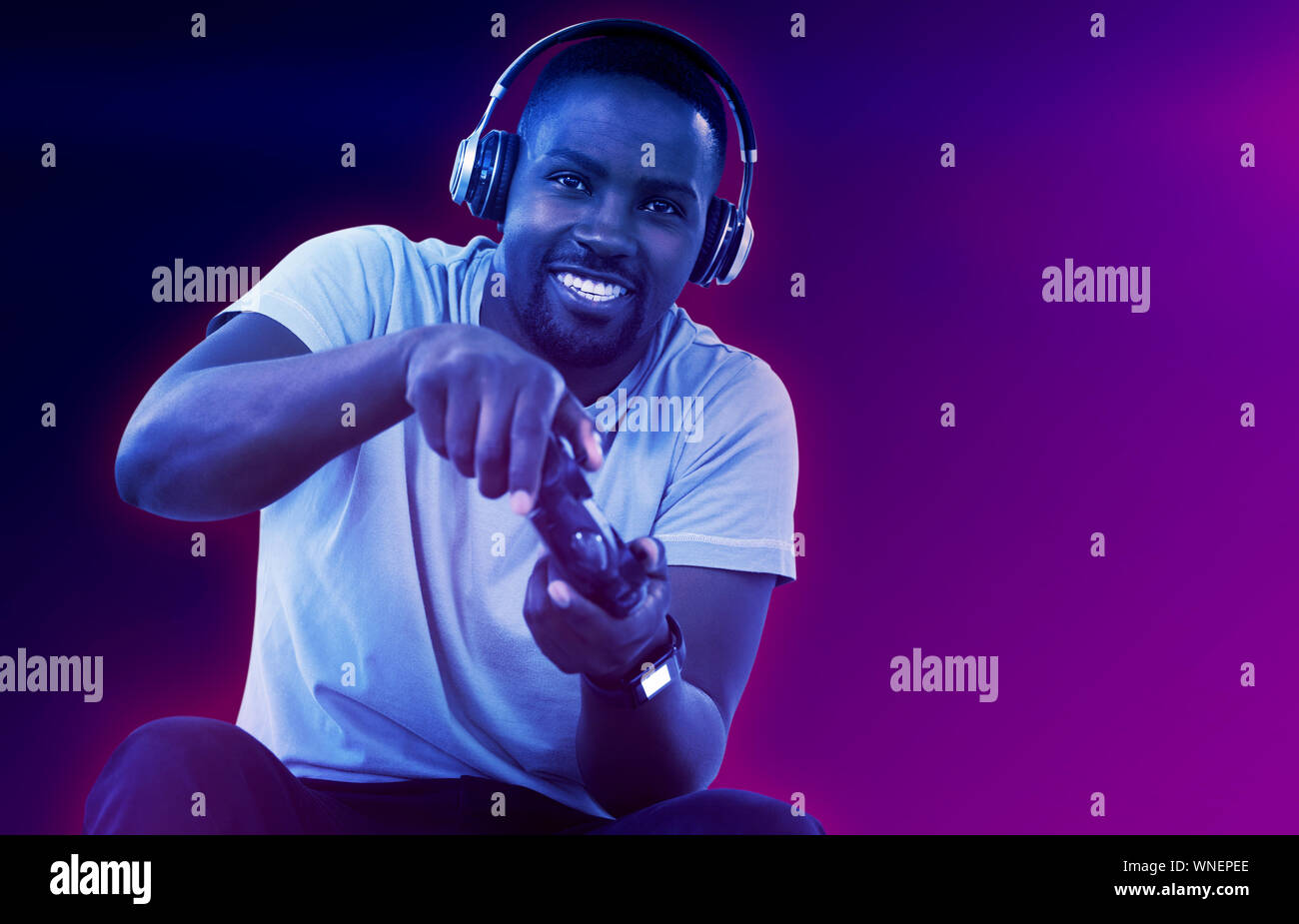 Composite image of man playing video game against white background ...