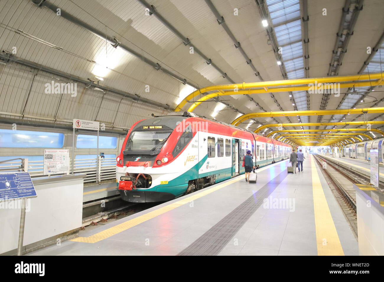 People travel at Leonardo da Vinci Fiumicino airport train station Rome ...