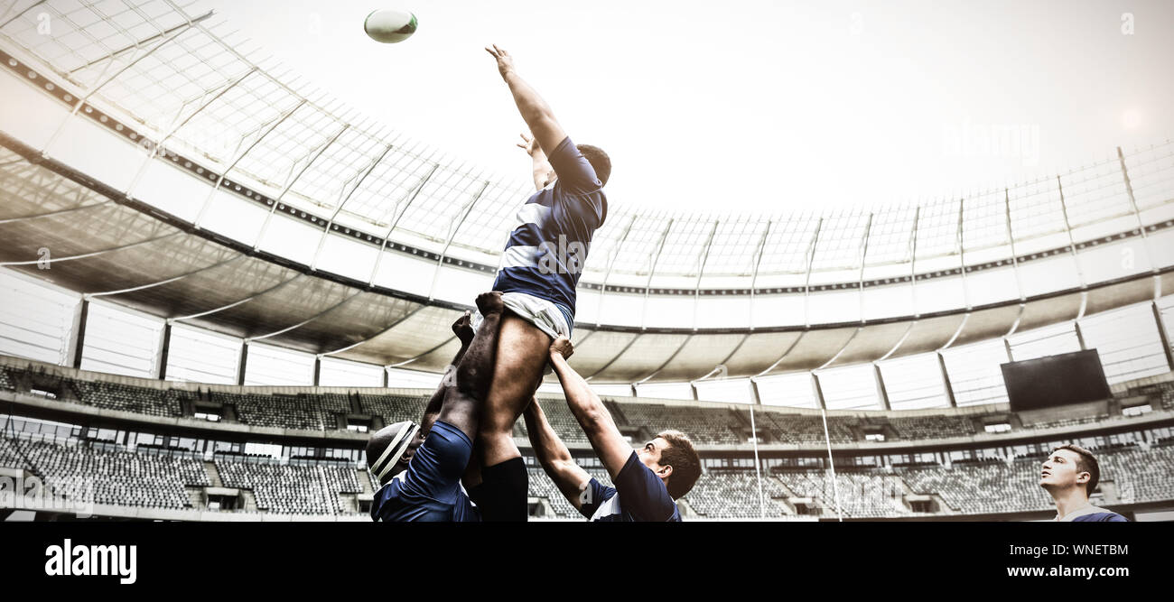 Group of diverse male rugby players playing rugby match in stadium ...