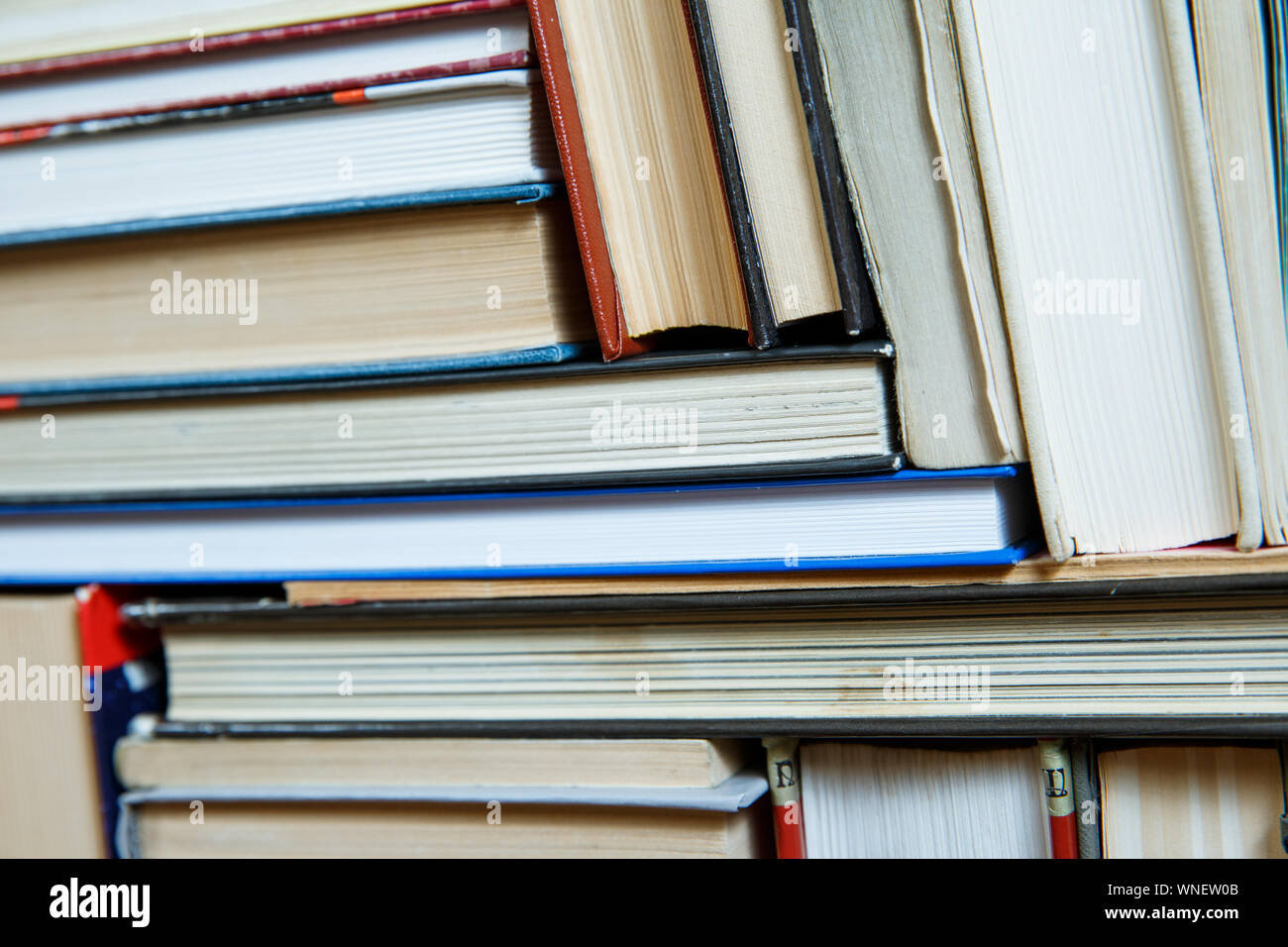 Books stack texture and background Stock Photo - Alamy