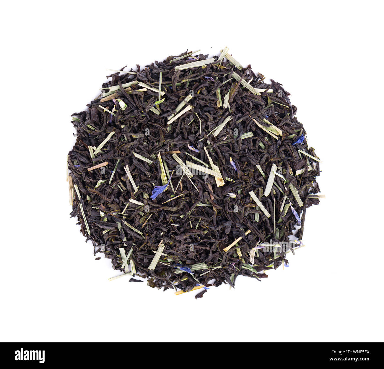Black Ceylon tea with lemongrass and cornflower petals isolated on a ...