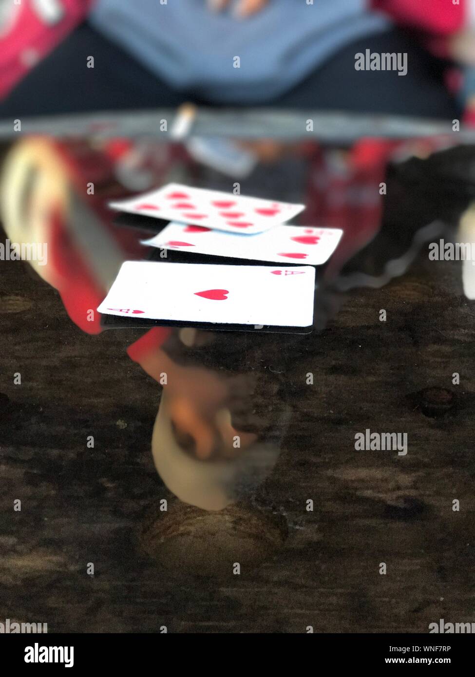 Playing cards on table hi-res stock photography and images - Alamy