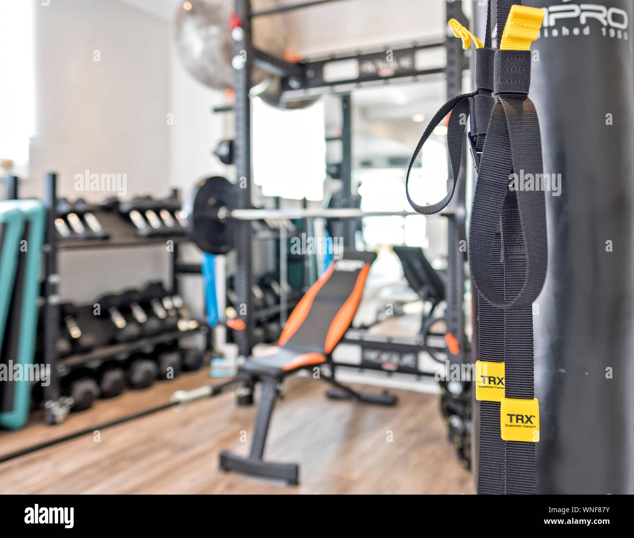 Fitness studio and gym with equipment Stock Photo - Alamy