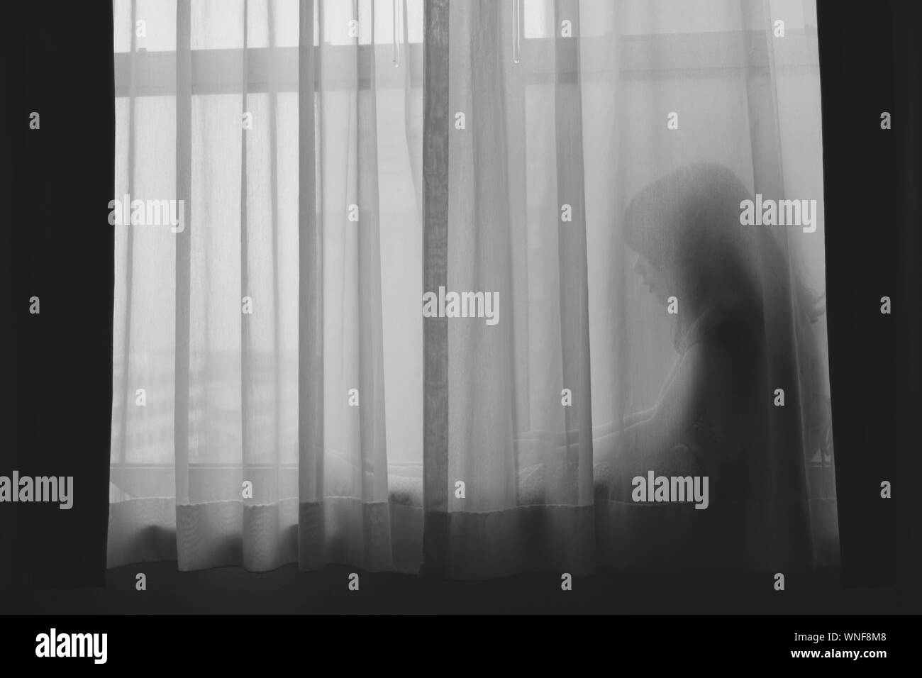 Child hiding Black and White Stock Photos & Images - Alamy