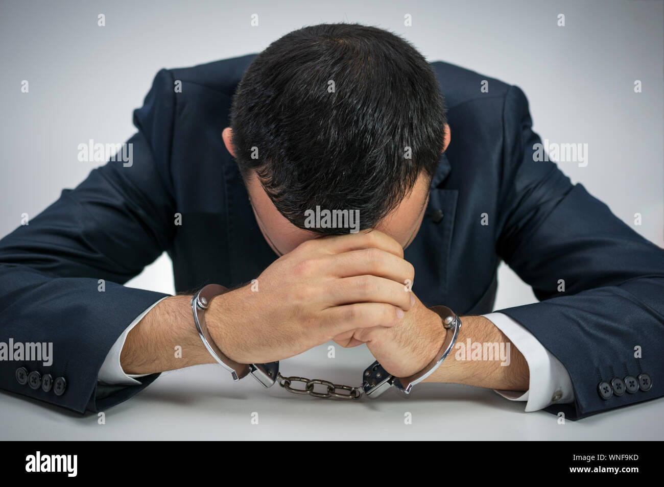 Businessman handcuffs hi-res stock photography and images - Alamy