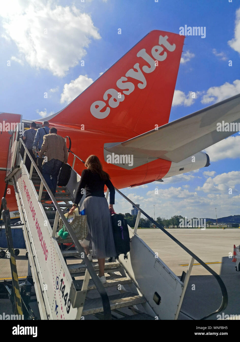 Passengers board an EasyJet Airbus A319 flight at Krakow Airport in ...