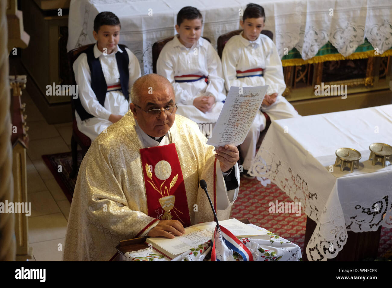 The priest preaches at the Mass on Thanksgiving day in Stitar, Croatia ...