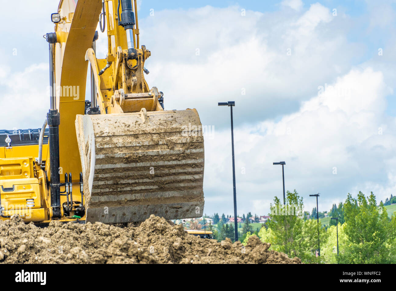 Excavator digging at contruction site for a new building Stock Photo ...