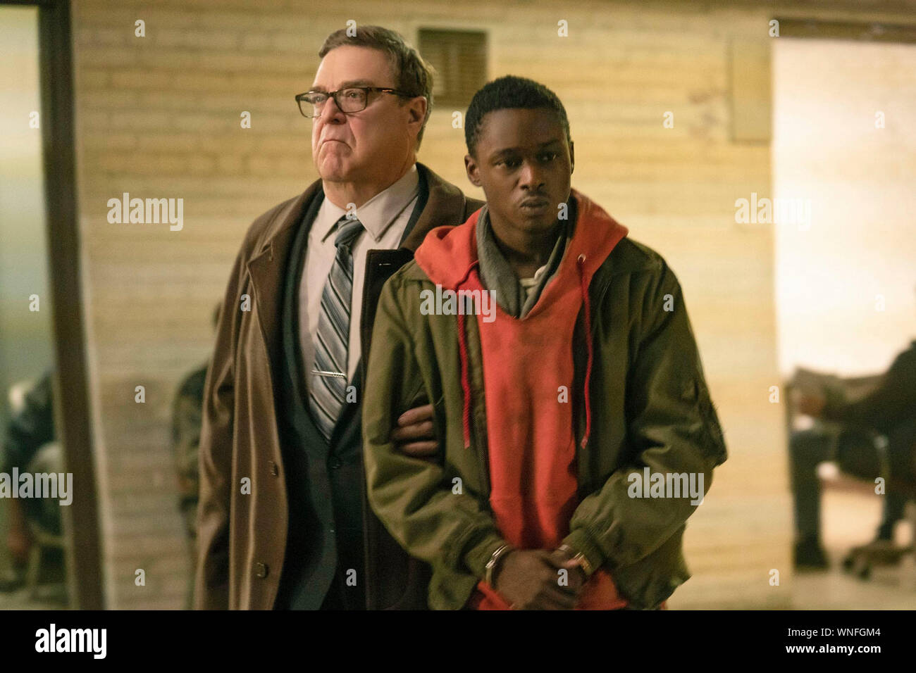 JOHN GOODMAN and ASHTON SANDERS in CAPTIVE STATE (2019), directed by ...