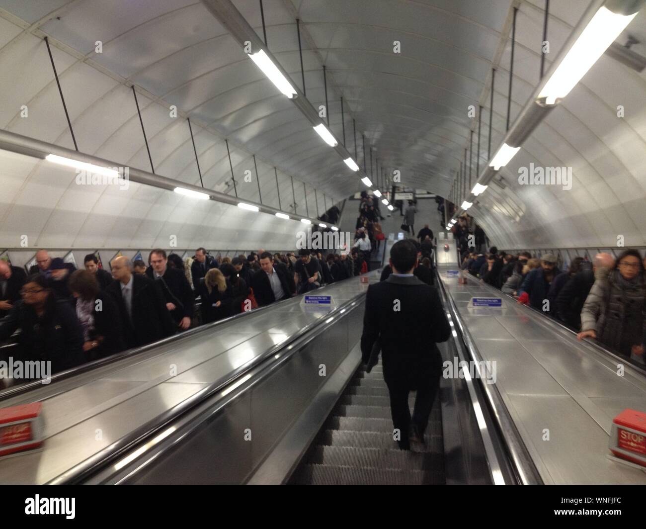 Underground escalators rush hi-res stock photography and images - Alamy