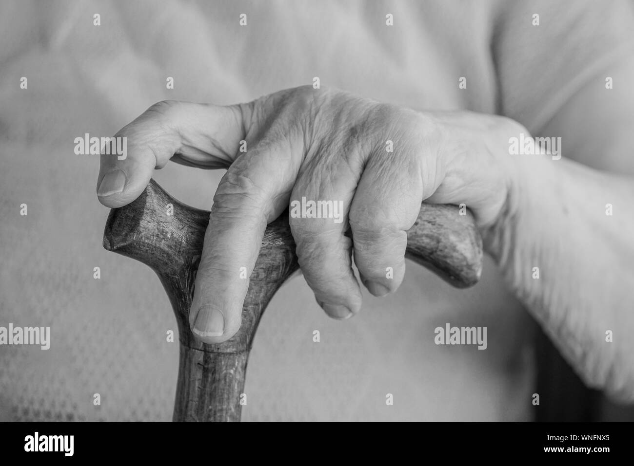Hands with cane Black and White Stock Photos & Images - Alamy