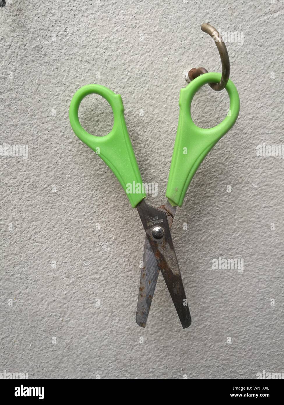 Hanging scissors hi-res stock photography and images - Alamy