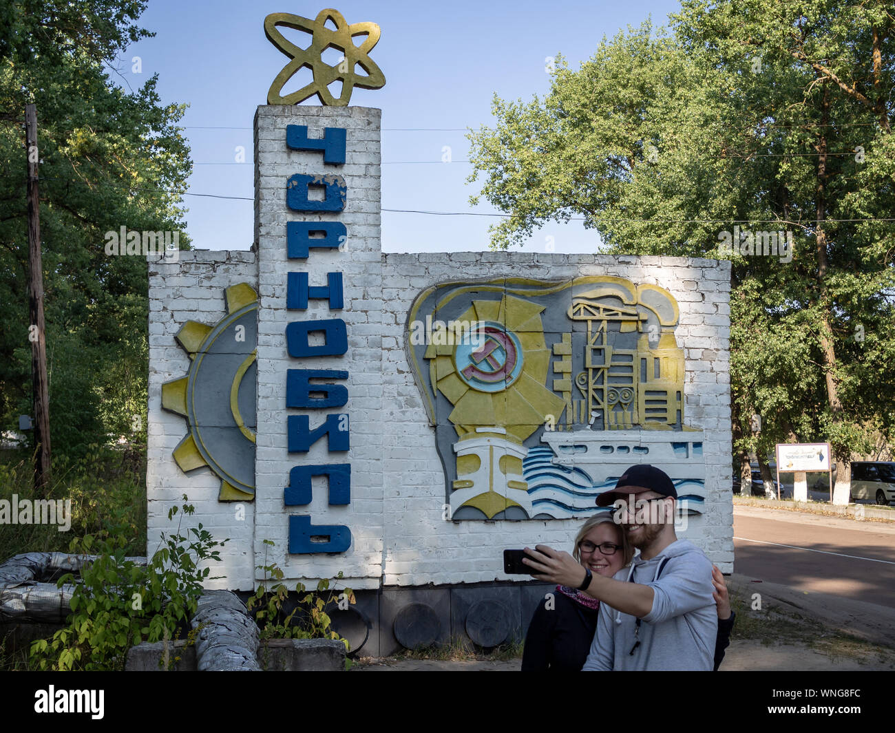 CHERNOBYL, UKRAINE-AUGUST 20, 2019: Couple of young tourists making ...