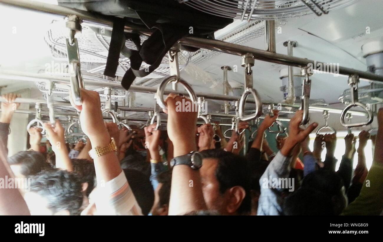 Crowded passenger train hi-res stock photography and images - Alamy