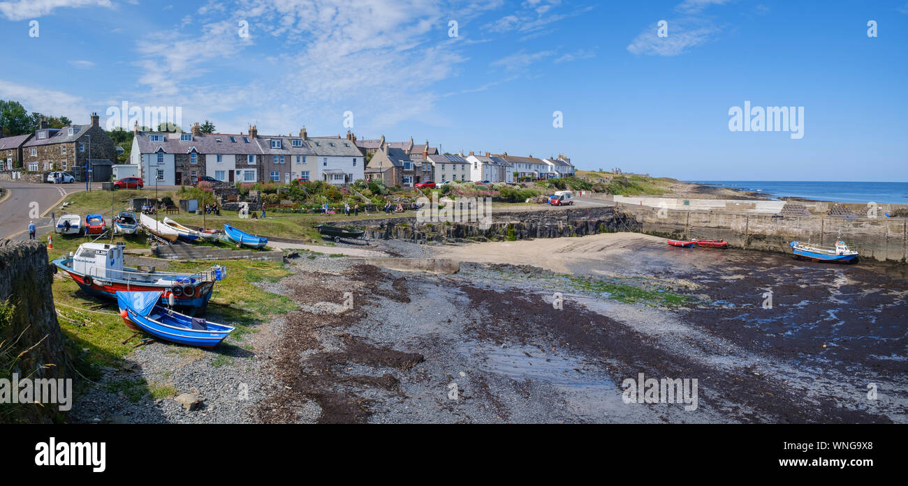 Boats and harbour of the coastal fishing village of Craster on the ...