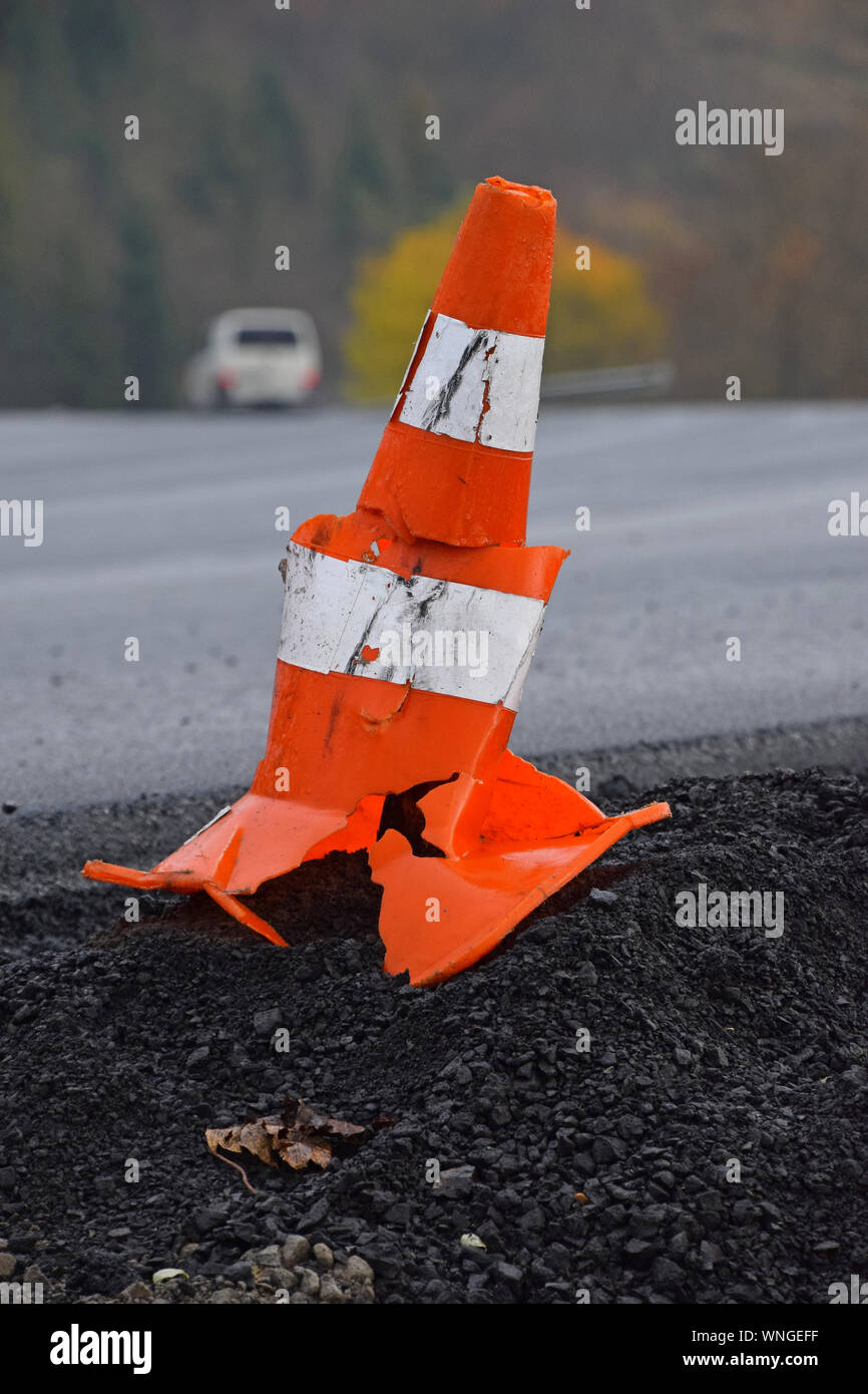 Traffic cone on broken hi-res stock photography and images - Alamy