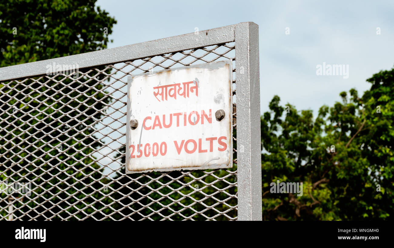 Caution 25000 high voltage safety warning sign in a clear and straight ...