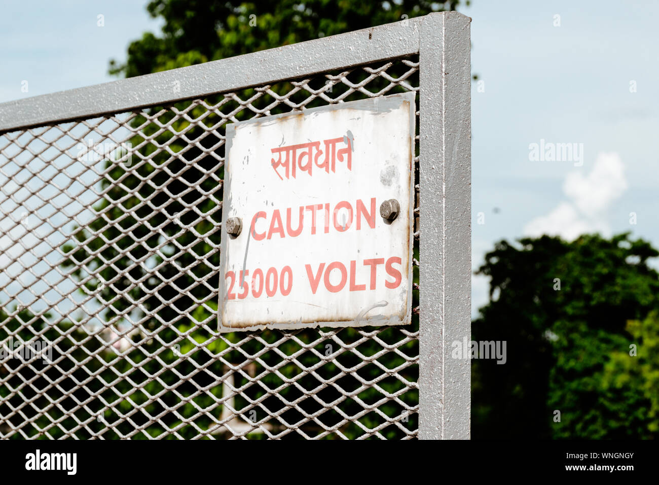 Caution 25000 high voltage safety warning sign in a clear and straight ...