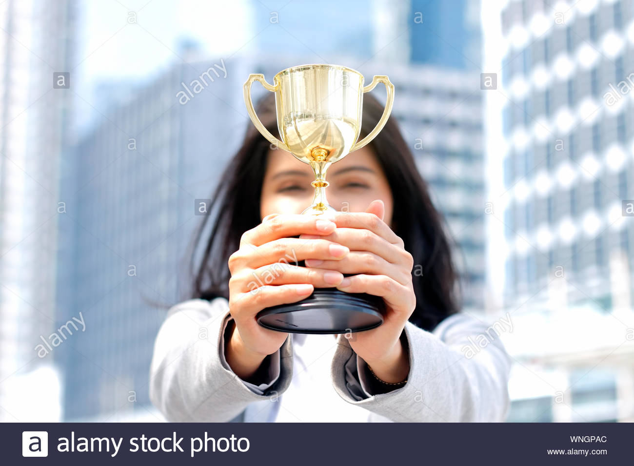 Woman Holding Trophy Stock Photos & Woman Holding Trophy Stock Images ...