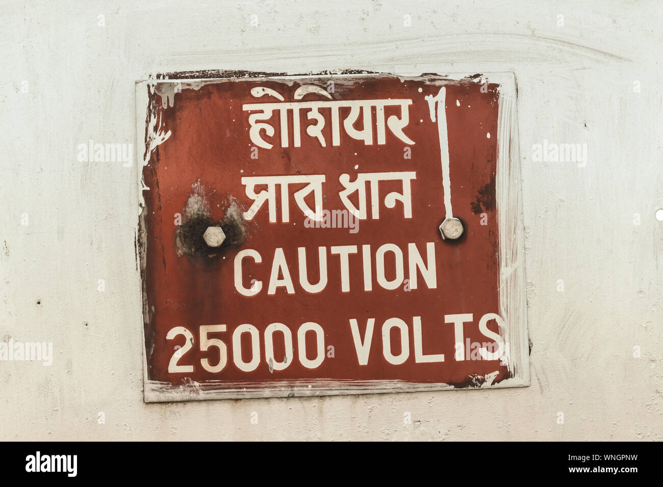 Caution 25000 high voltage safety warning sign in a clear and straight ...