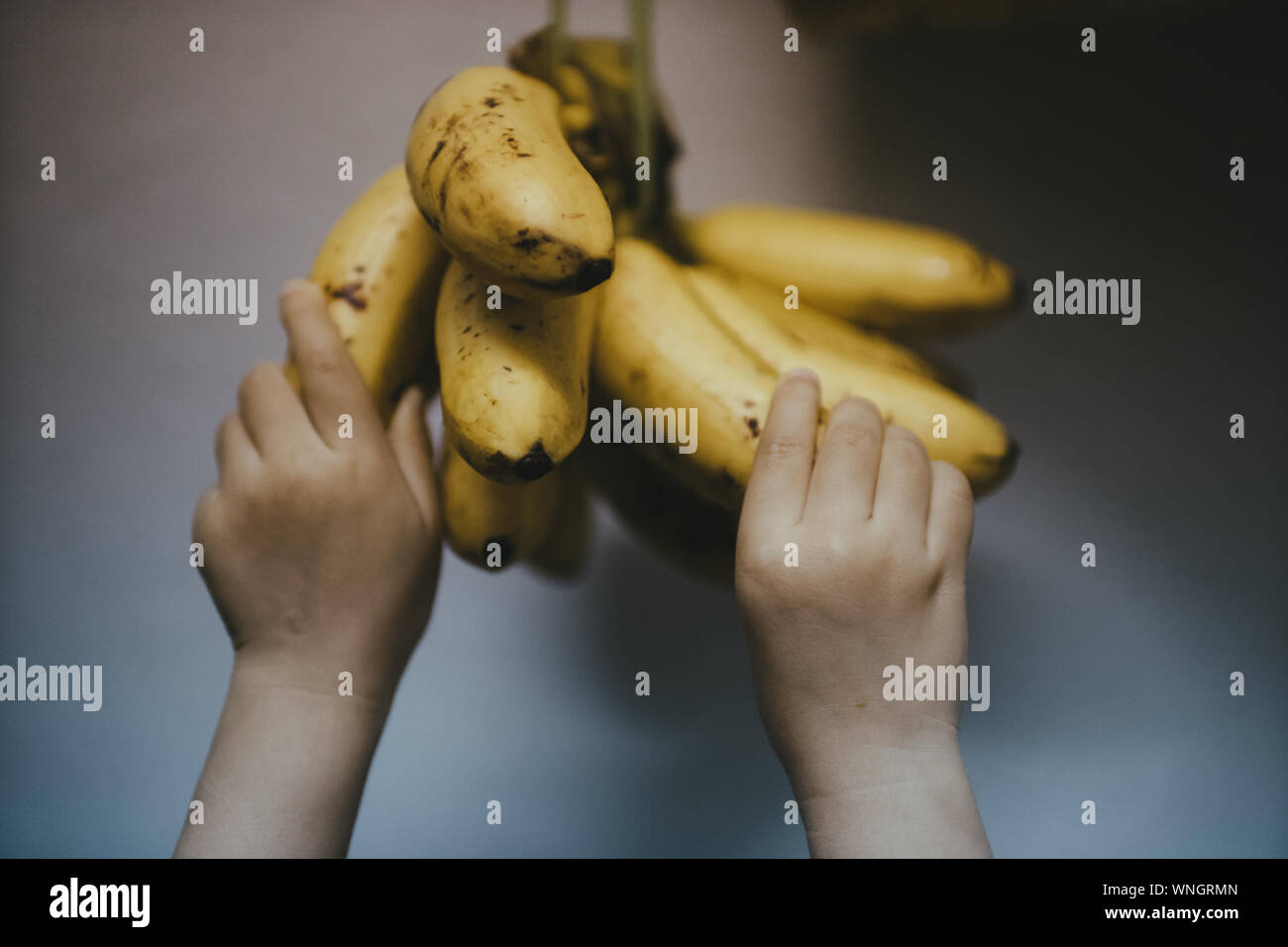 Hands bananas hi-res stock photography and images - Alamy